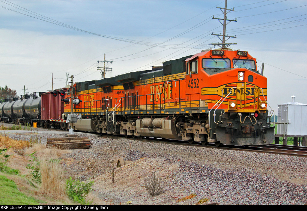 BNSF 4552 Leading a loaded oil can SB.